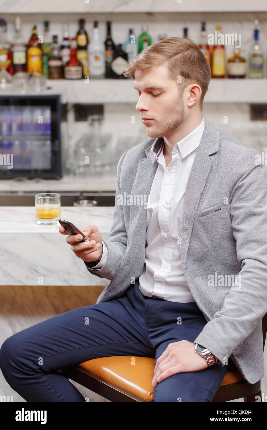 Waiting for friends in the bar Stock Photo - Alamy