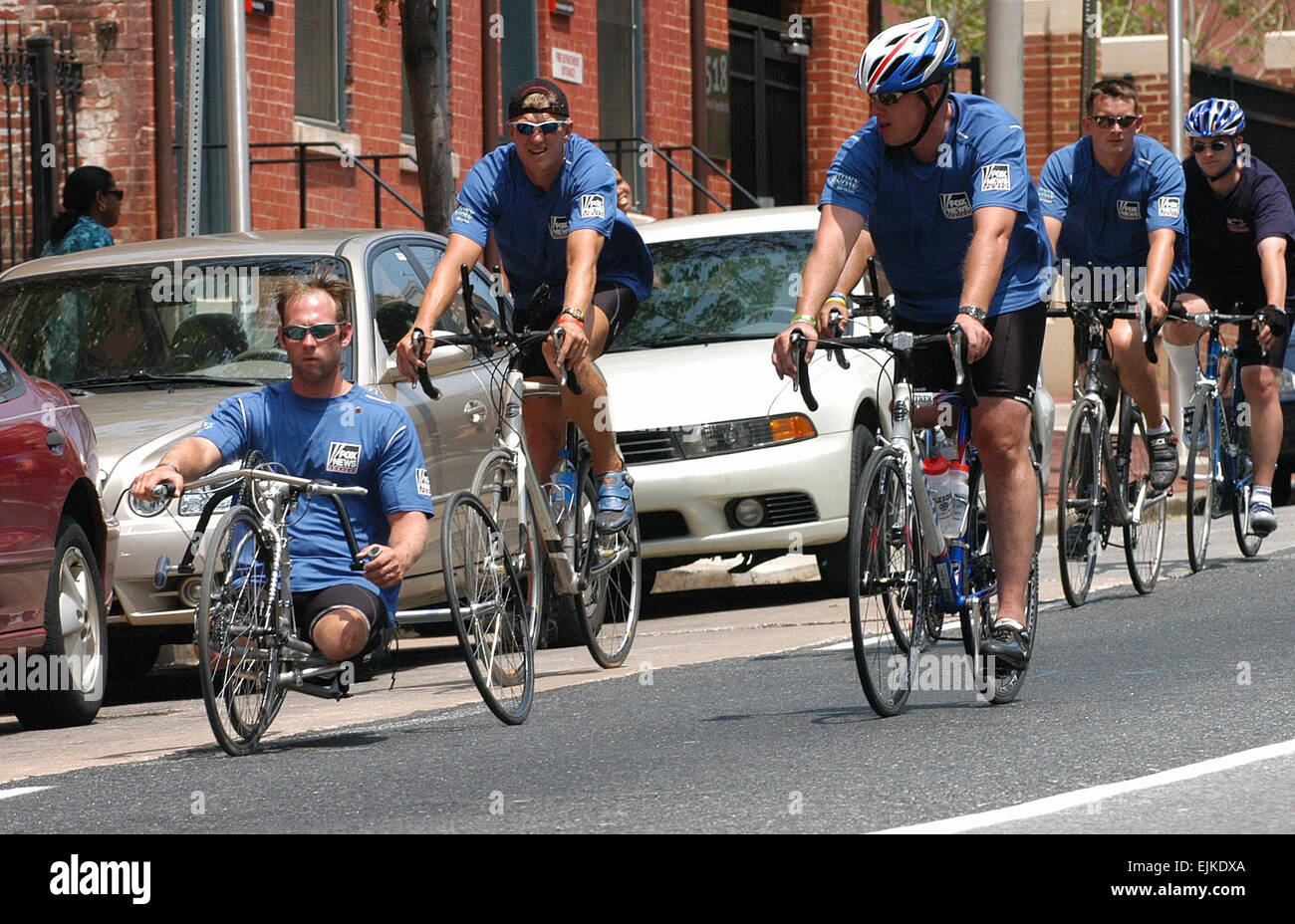 Staff Sgt. Heath Calhoun, left, leads the Soldier Ride 2005 group into ...