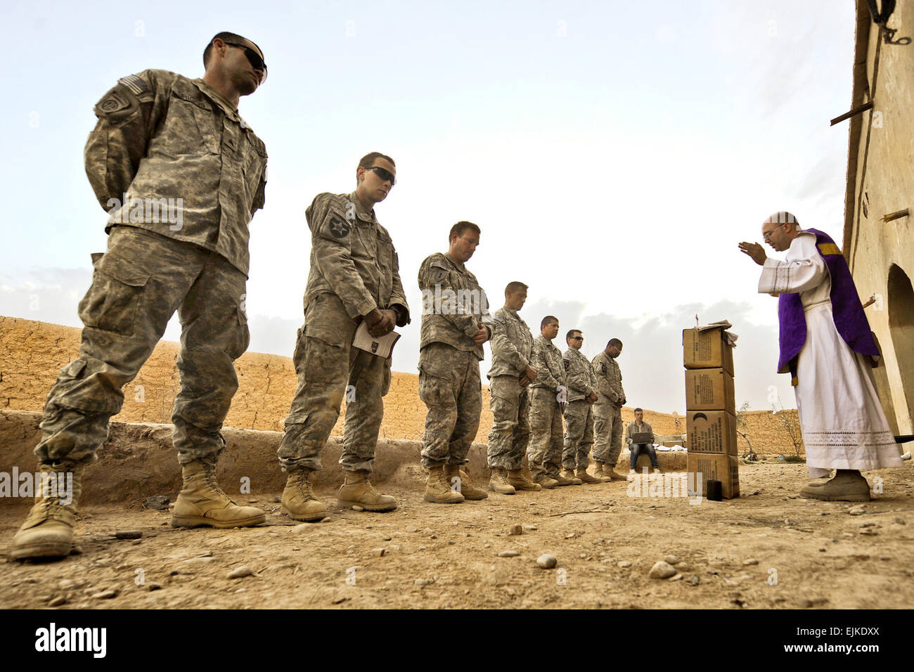 U.S. Army Capt. Carl Subler, right, a chaplain, celebrates Catholic ...