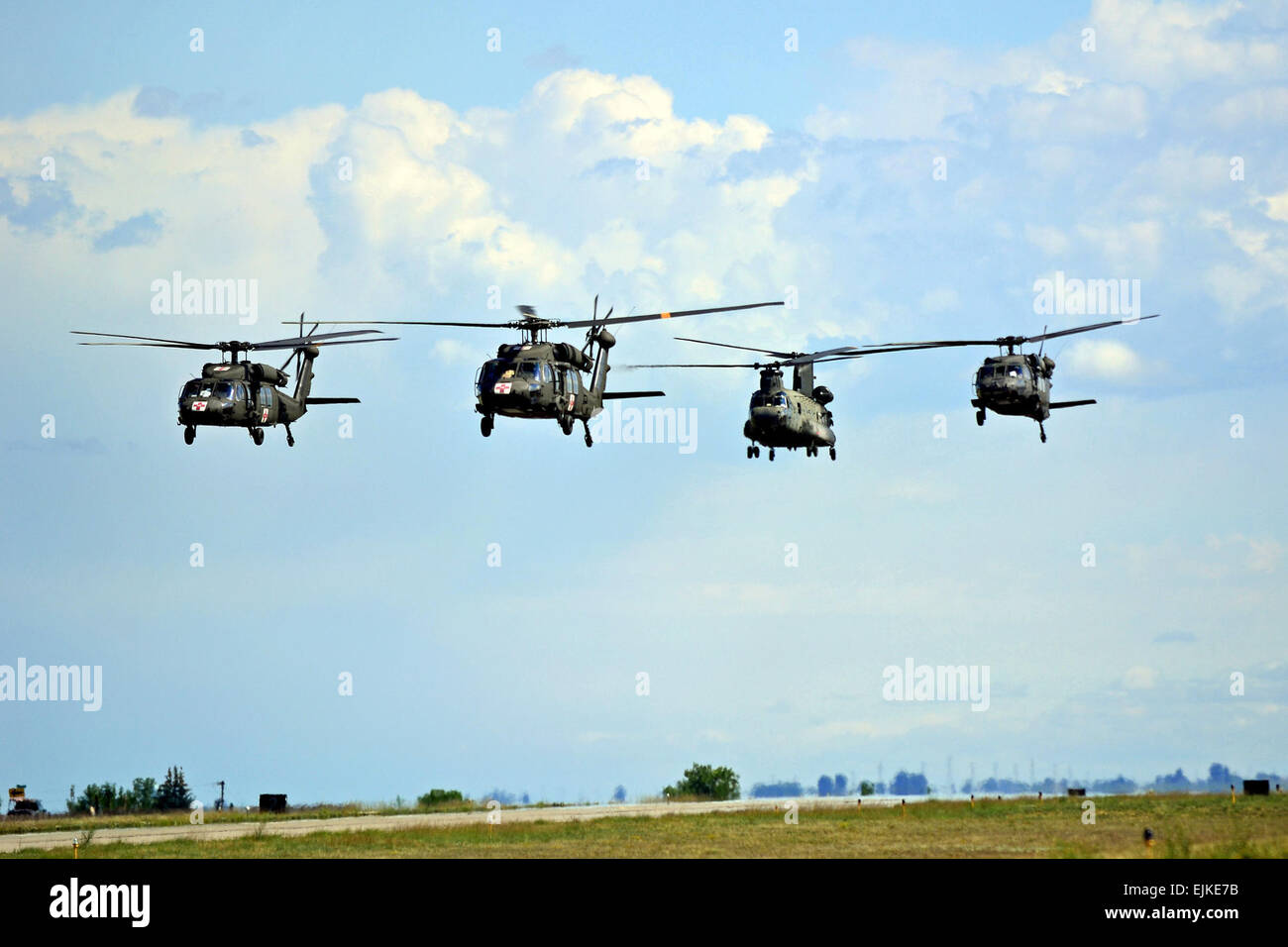 A formation of UH-60 Black Hawk and CH-47 Chinook helicopters finish ...