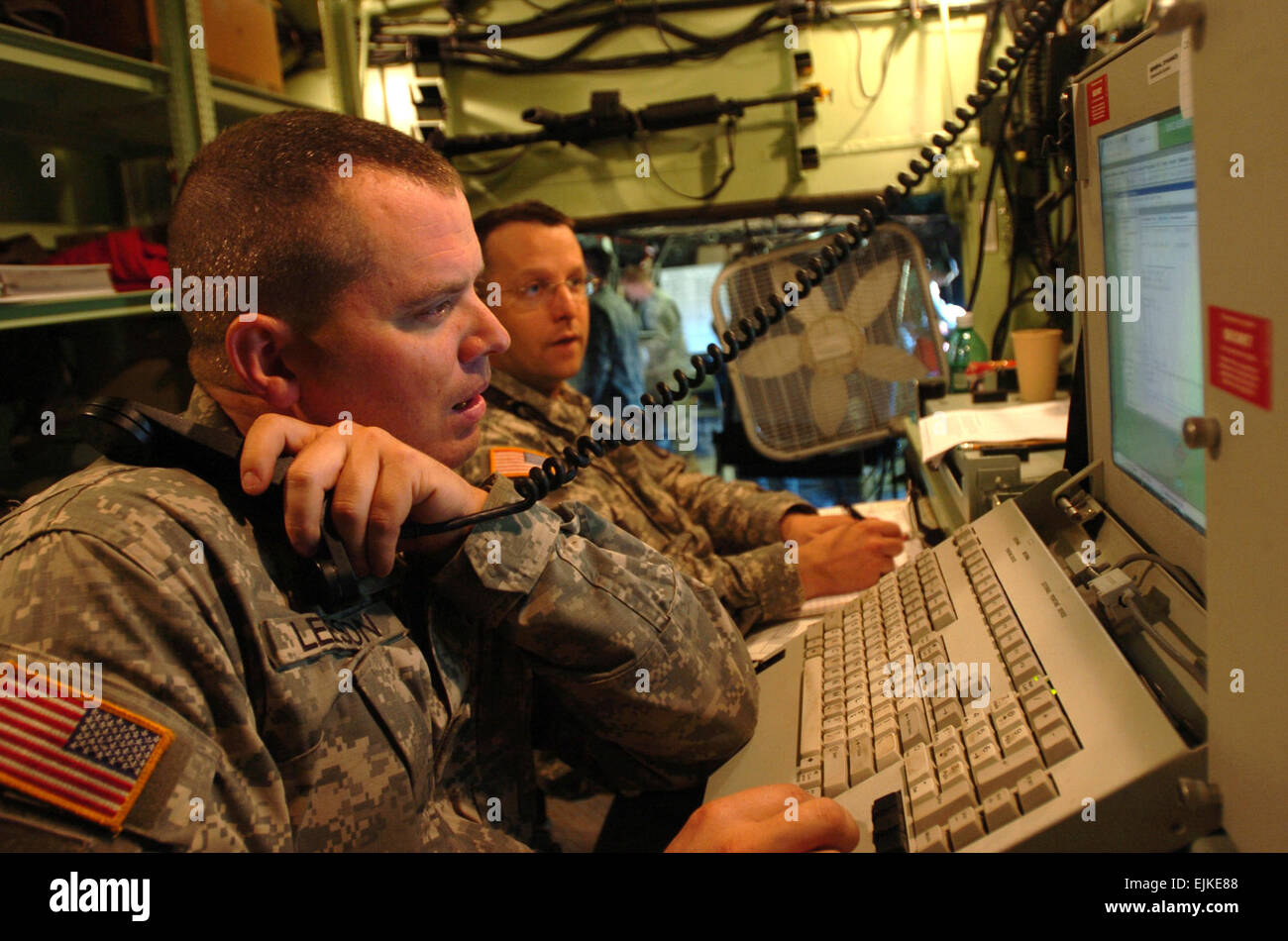 U.S. Army Staff Sgt. Derrick Leeson, left, the assistant battery fire ...