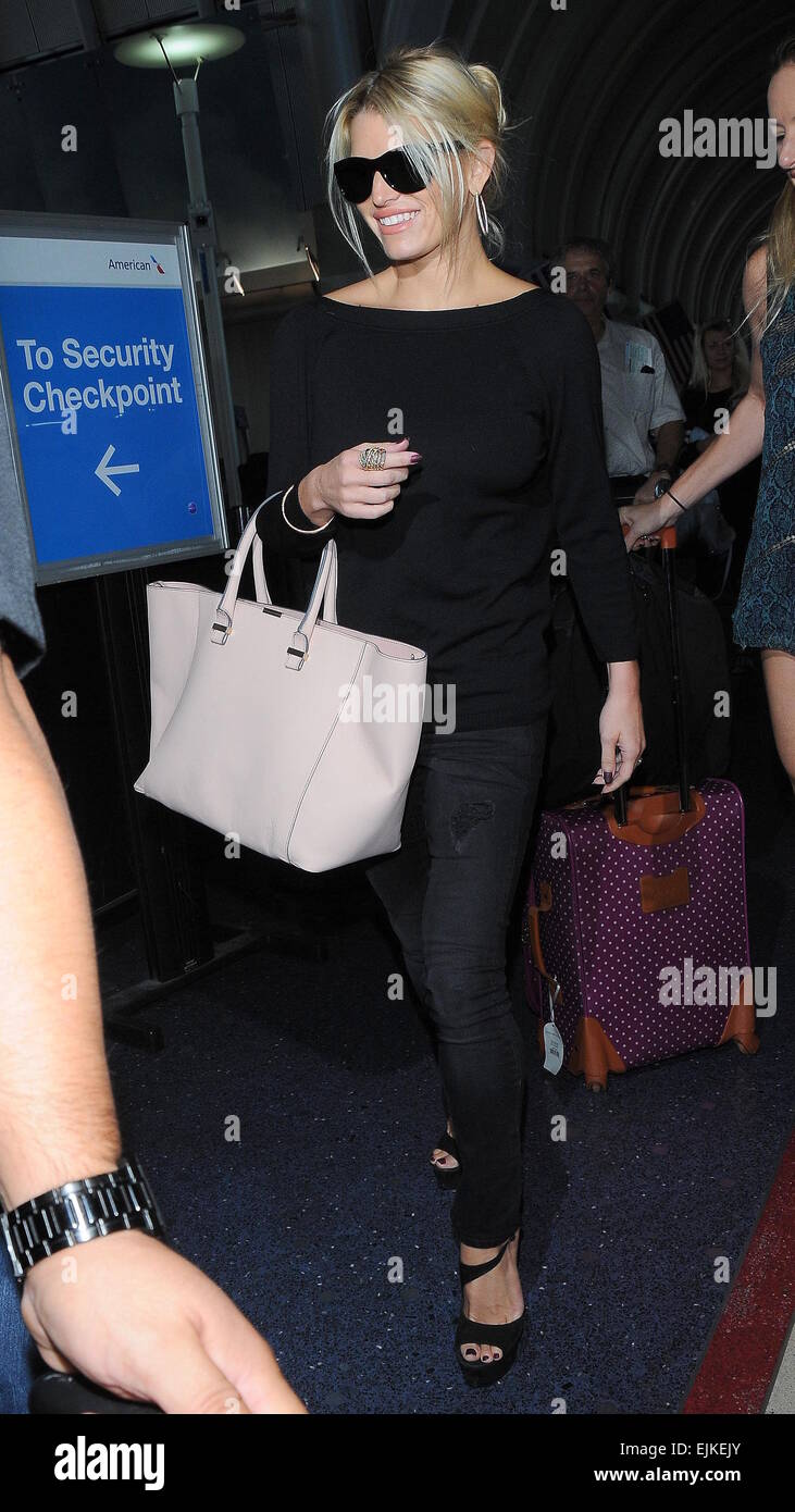Jessica Simpson looks fashionable and happy as she arrives alone at Los ...