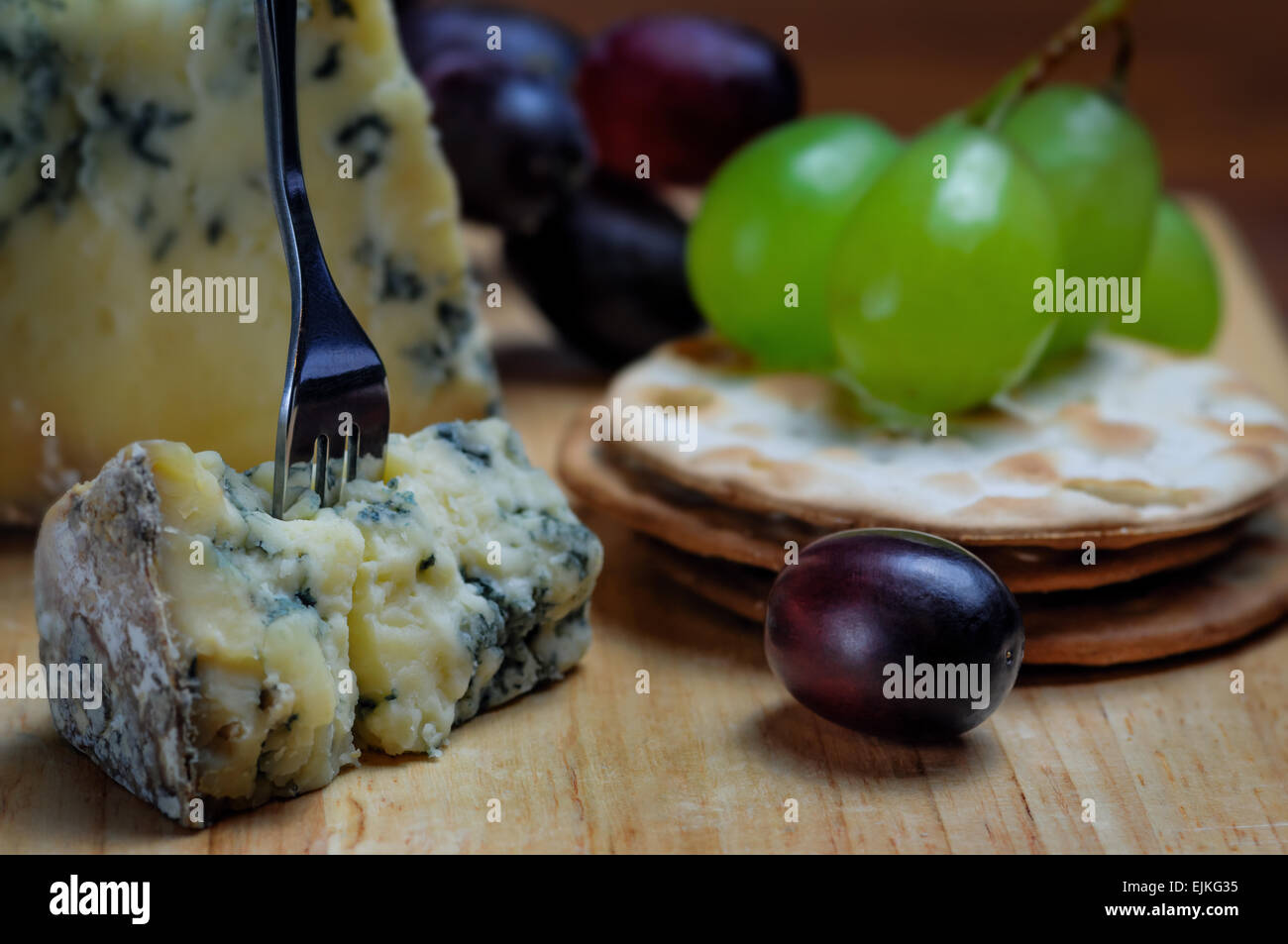 Roquefort blue cheese with grapes and crackers Stock Photo - Alamy