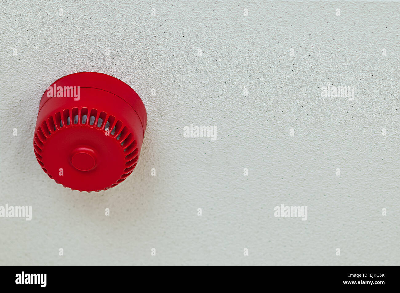 Domestic fire alarm sound alert red round ceiling Stock Photo - Alamy