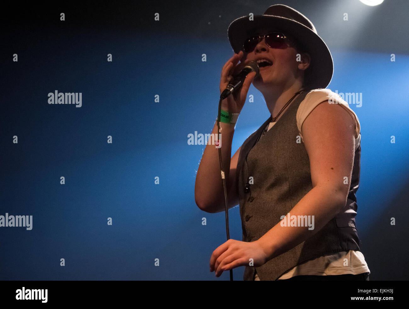 British woman on stage in a band singing Stock Photo - Alamy