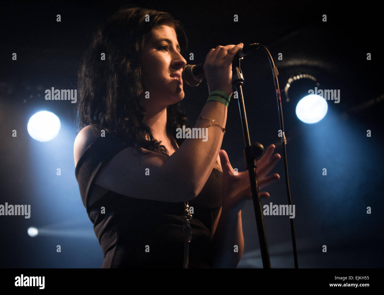 British woman on stage in a band singing Stock Photo - Alamy