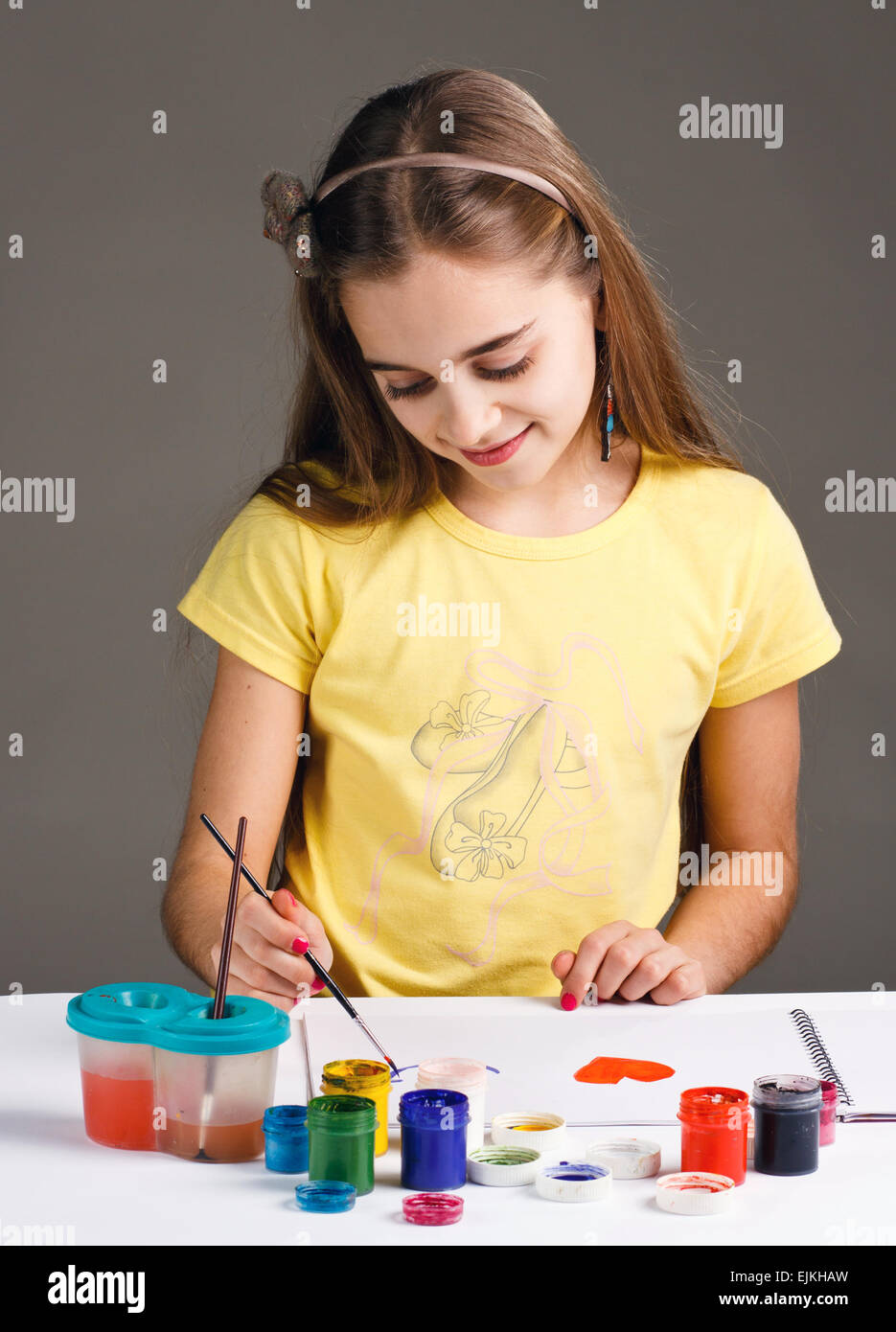 girl paints a colorful paint Stock Photo - Alamy