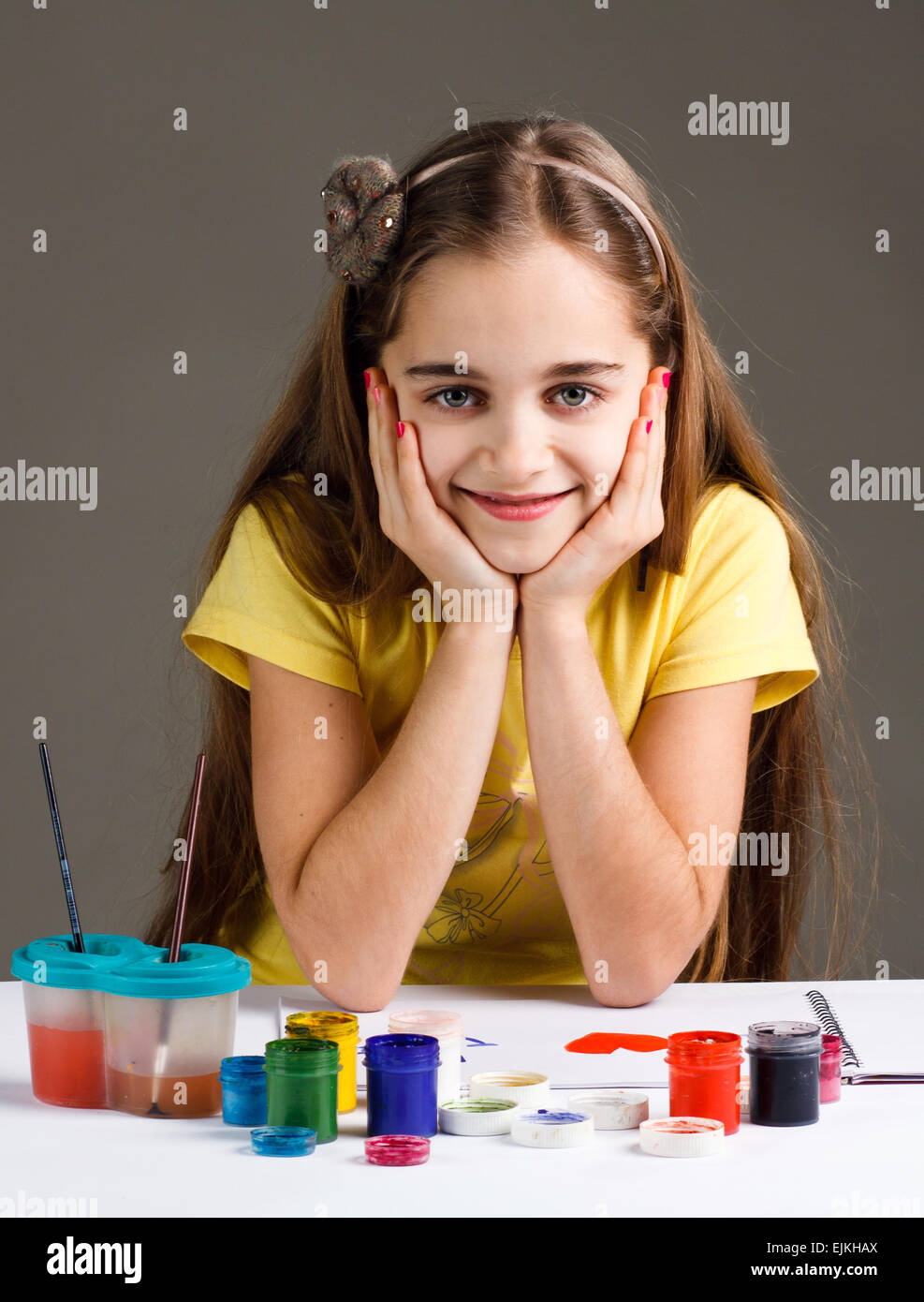 girl paints a colorful paint Stock Photo - Alamy
