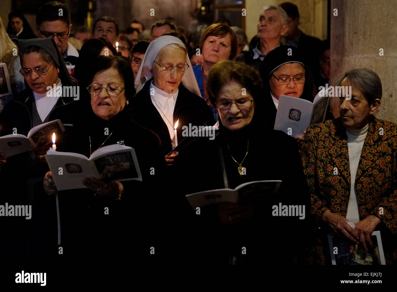 Catholic Christians take part in a Roman Catholic mass procession ...