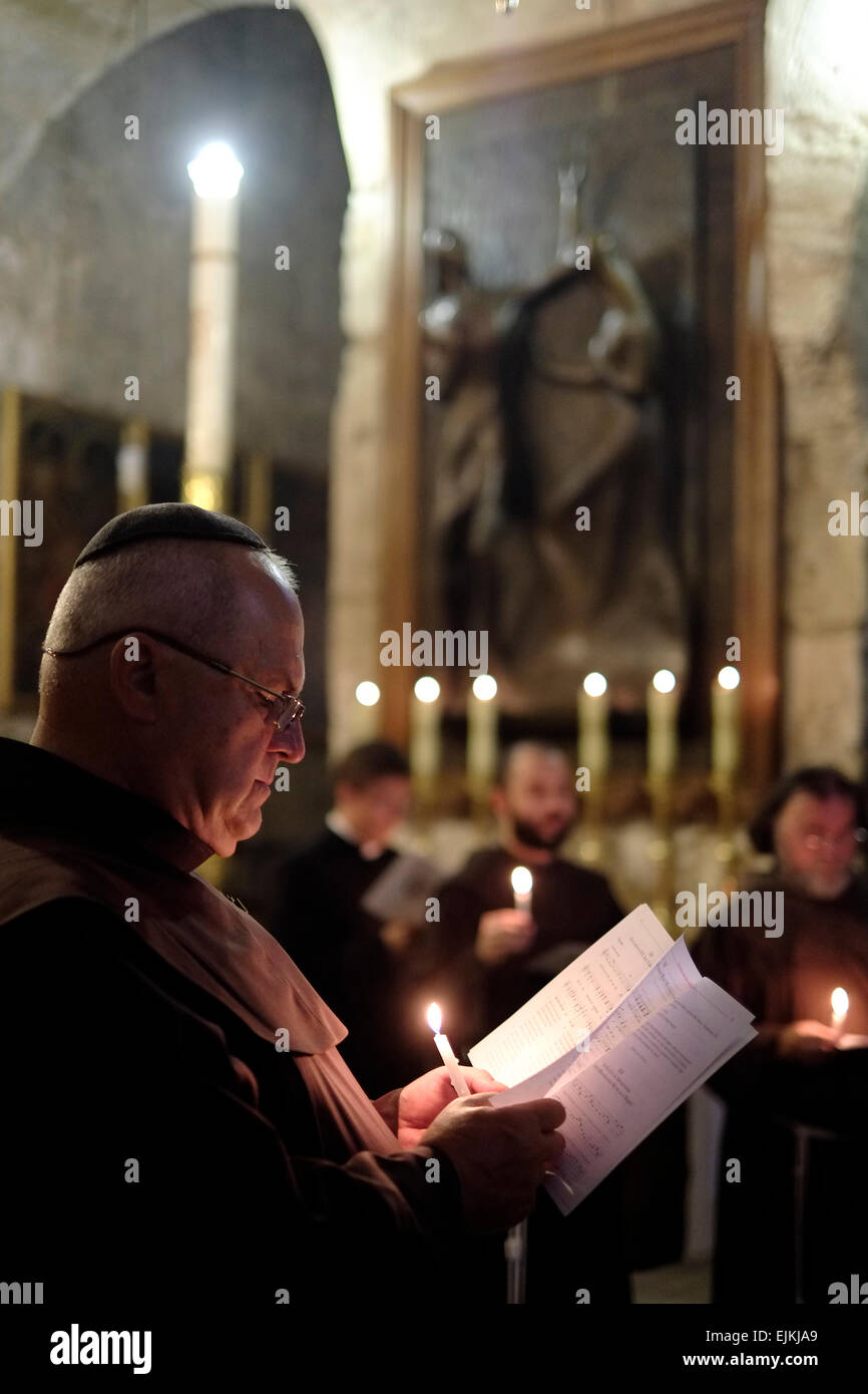 A Franciscan friar praying in Chapel of Mary Magdaleneinside inside the ...