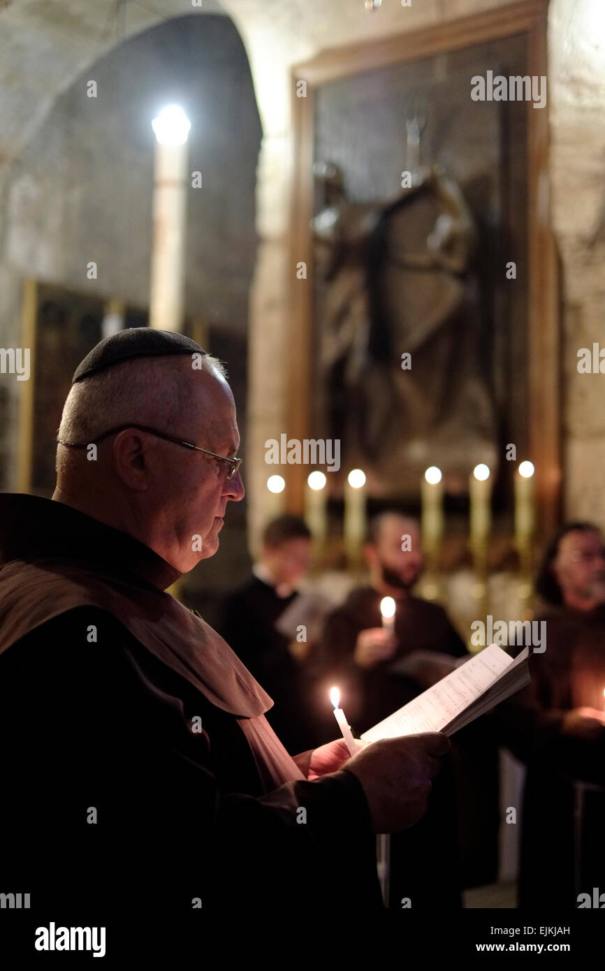 A Franciscan friar praying in Chapel of Mary Magdalene inside the ...