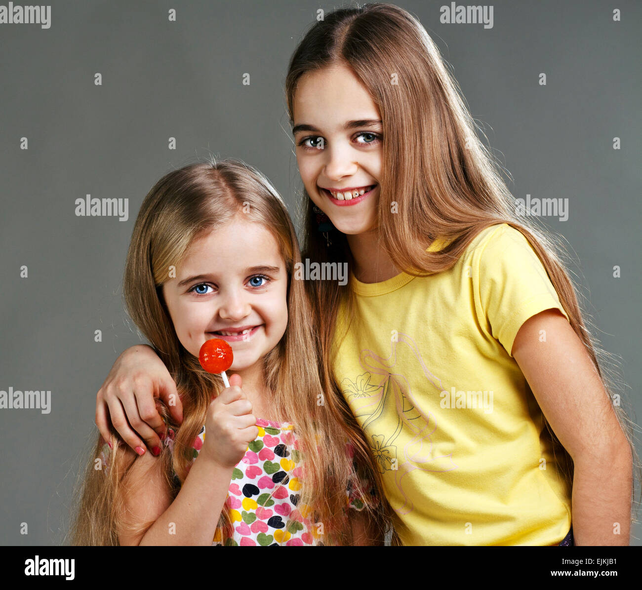 two girls with candy Stock Photo - Alamy