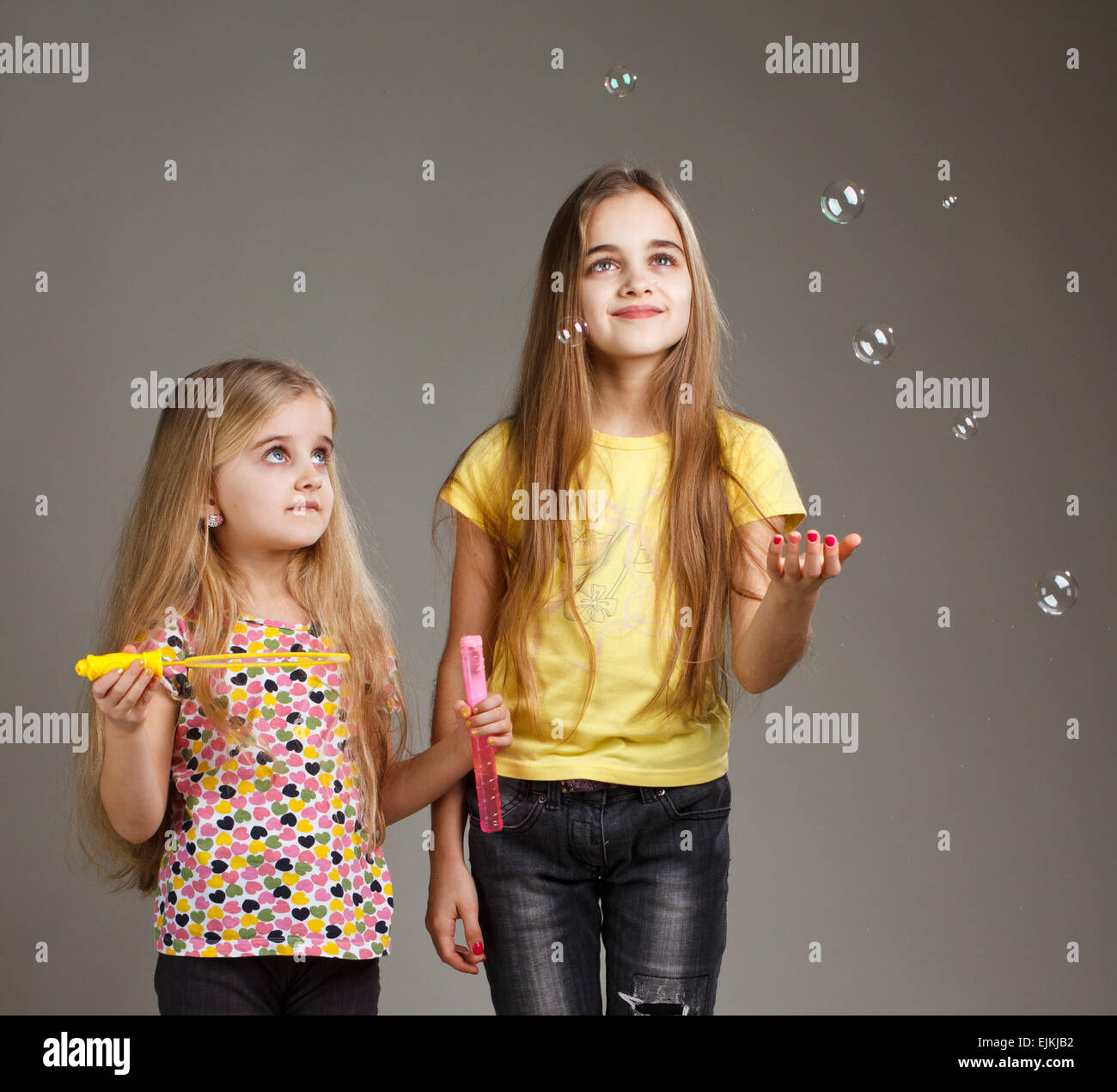 two girls play bubble Stock Photo - Alamy