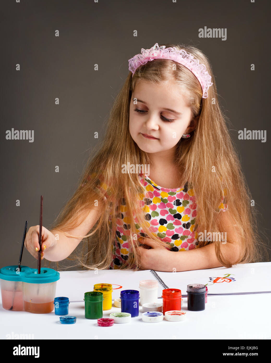 Beautiful blonde woman artist paints hi-res stock photography and ...