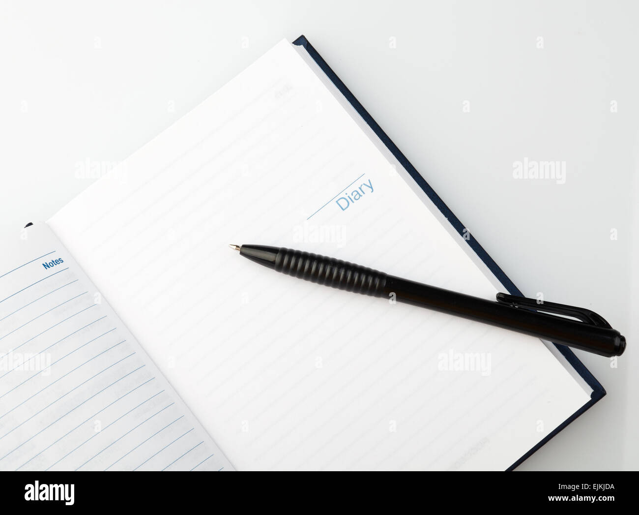 Open notebook with pen Stock Photo - Alamy