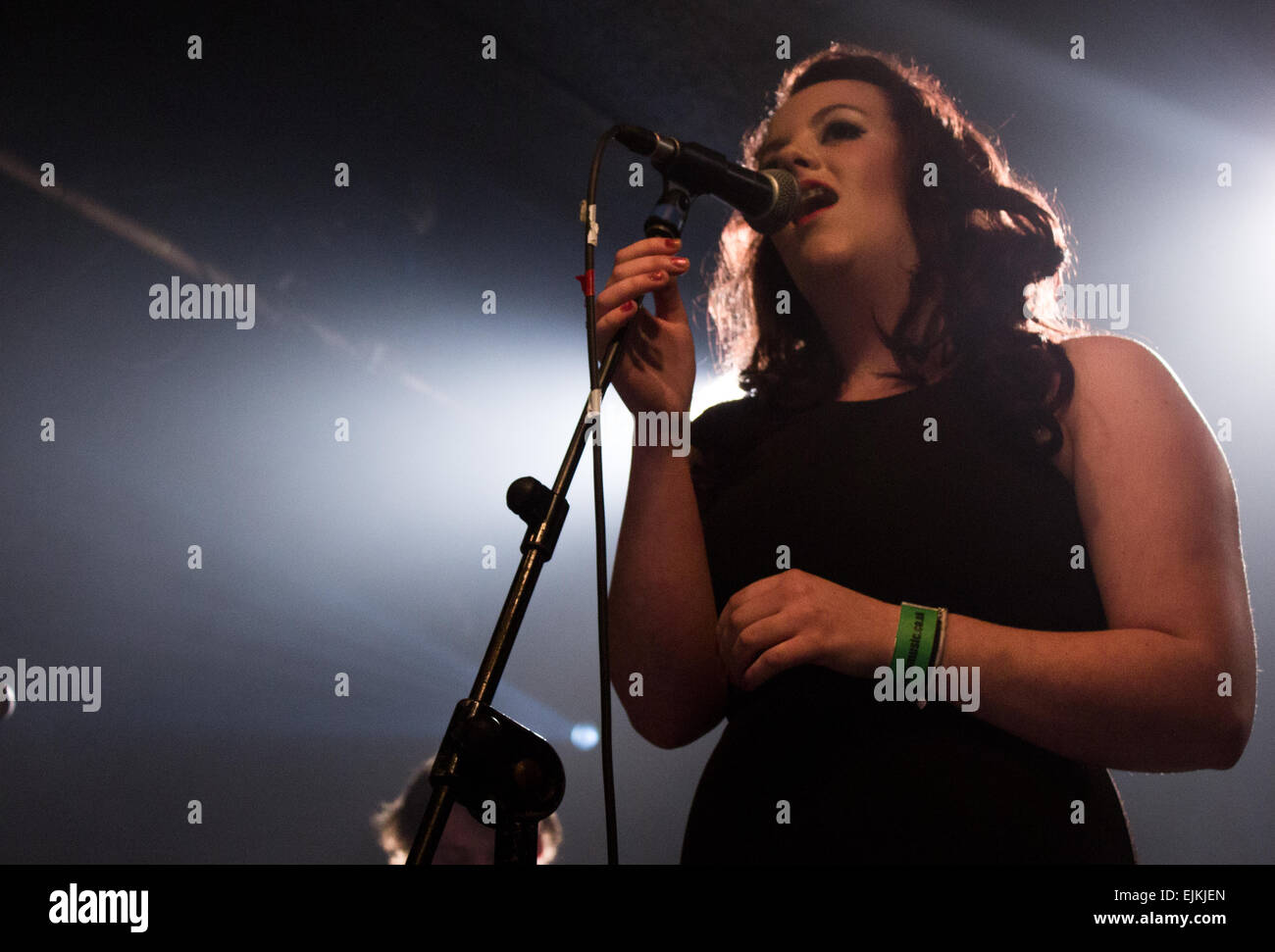 British female vocalist singing in a band at a venue in Hampshire, UK ...