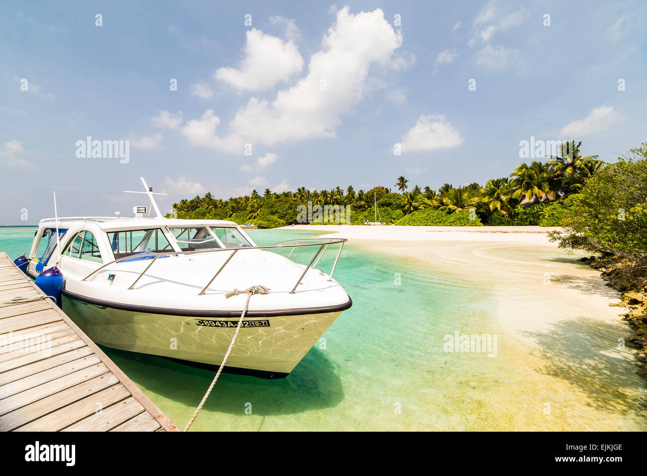 A Speed boat moored up at the jetty at Makunudu in the Maldives Stock ...