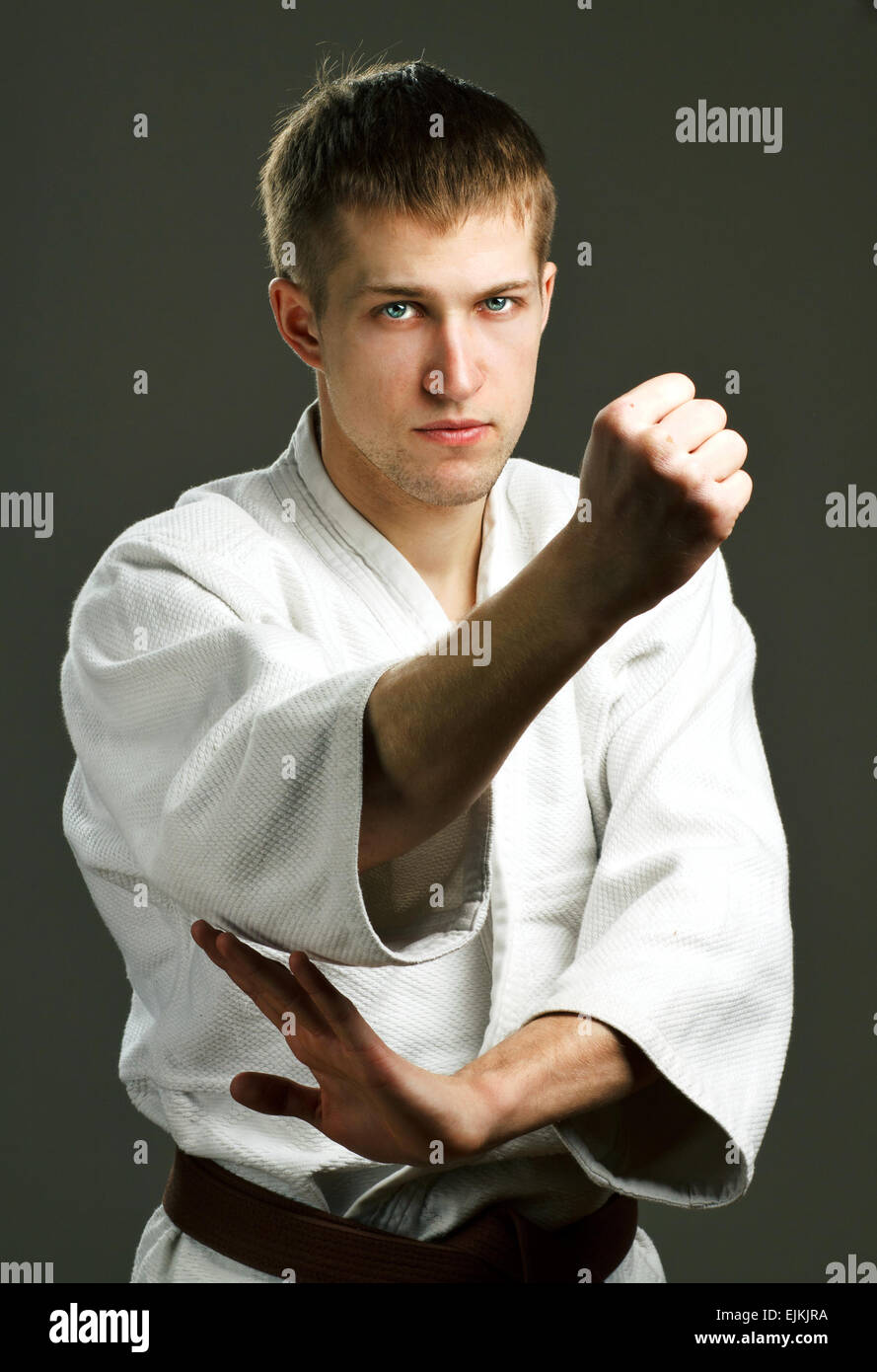 Strong man fighter in white hi-res stock photography and images - Alamy