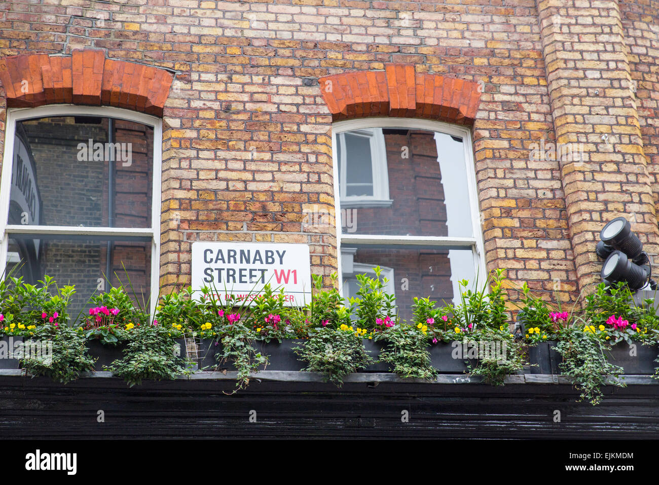 Carnaby Street sign , London, with window boxes full of flowers Stock ...