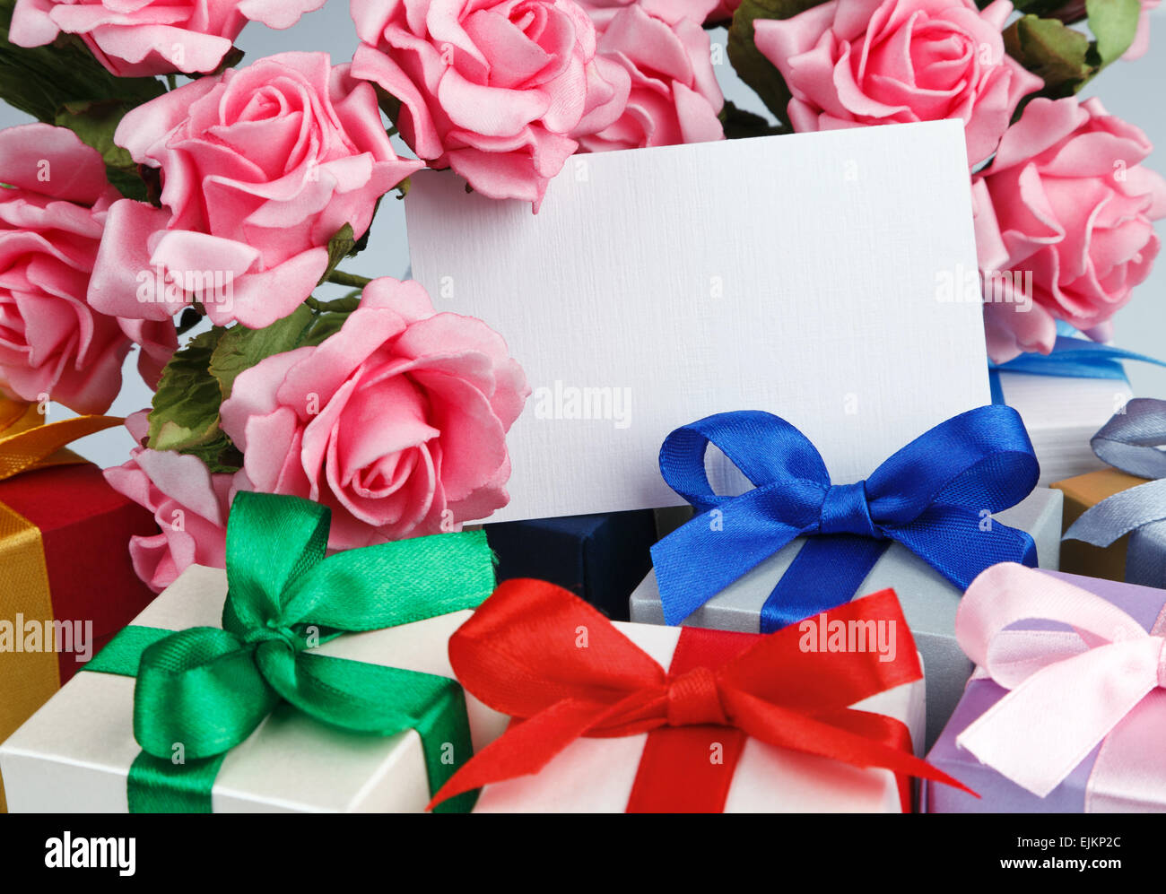 Greeting card with flowers and gifts Stock Photo - Alamy