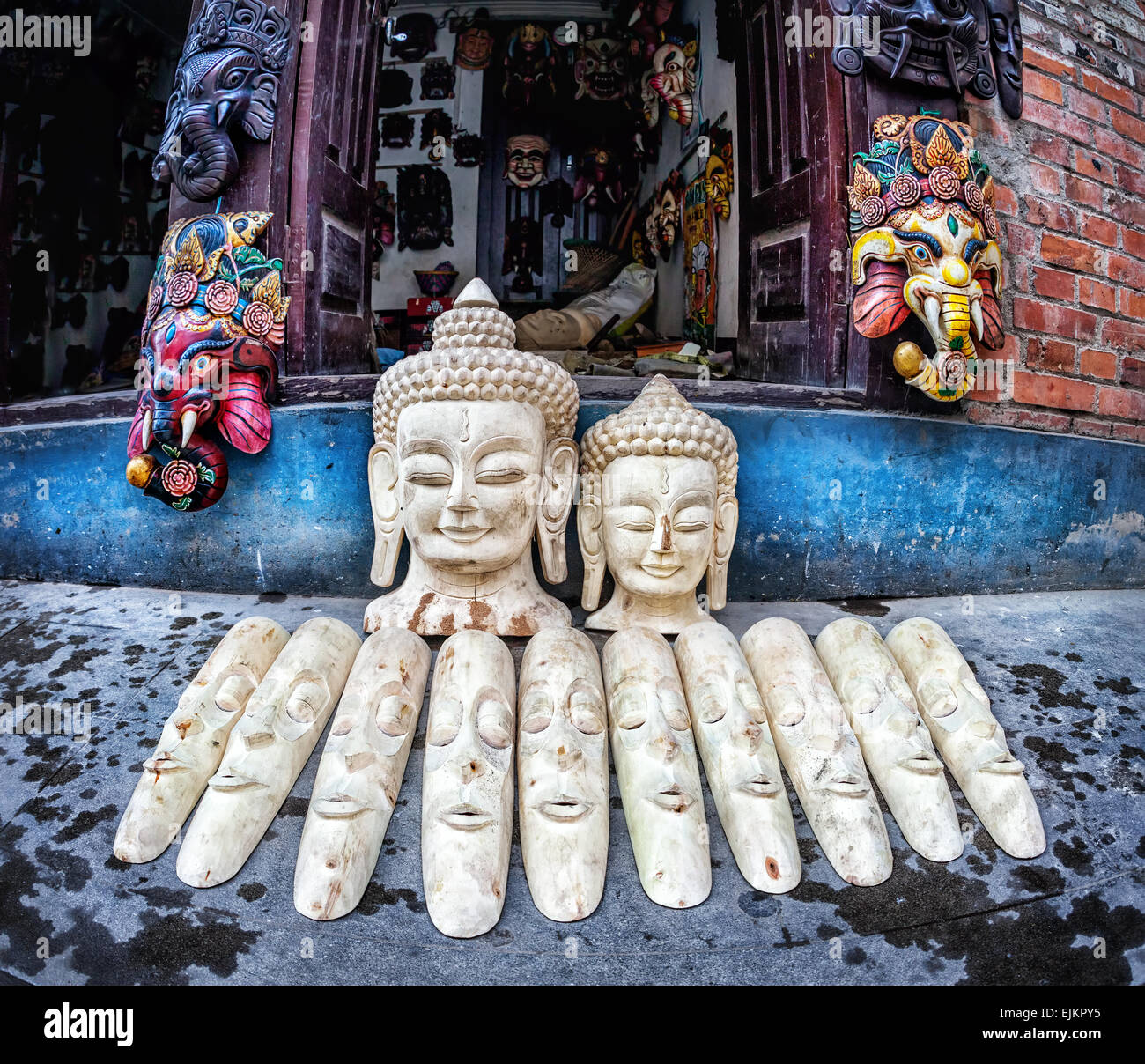 Buddha and Ganesh heads and other souvenir masks in the shop of Patan ...