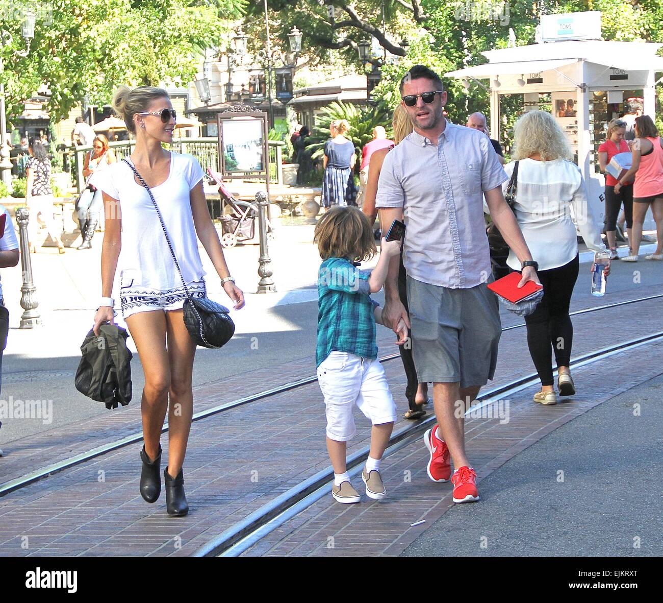 LA Galaxy captain, Robbie Keane with Claudine Palmer with their son ...