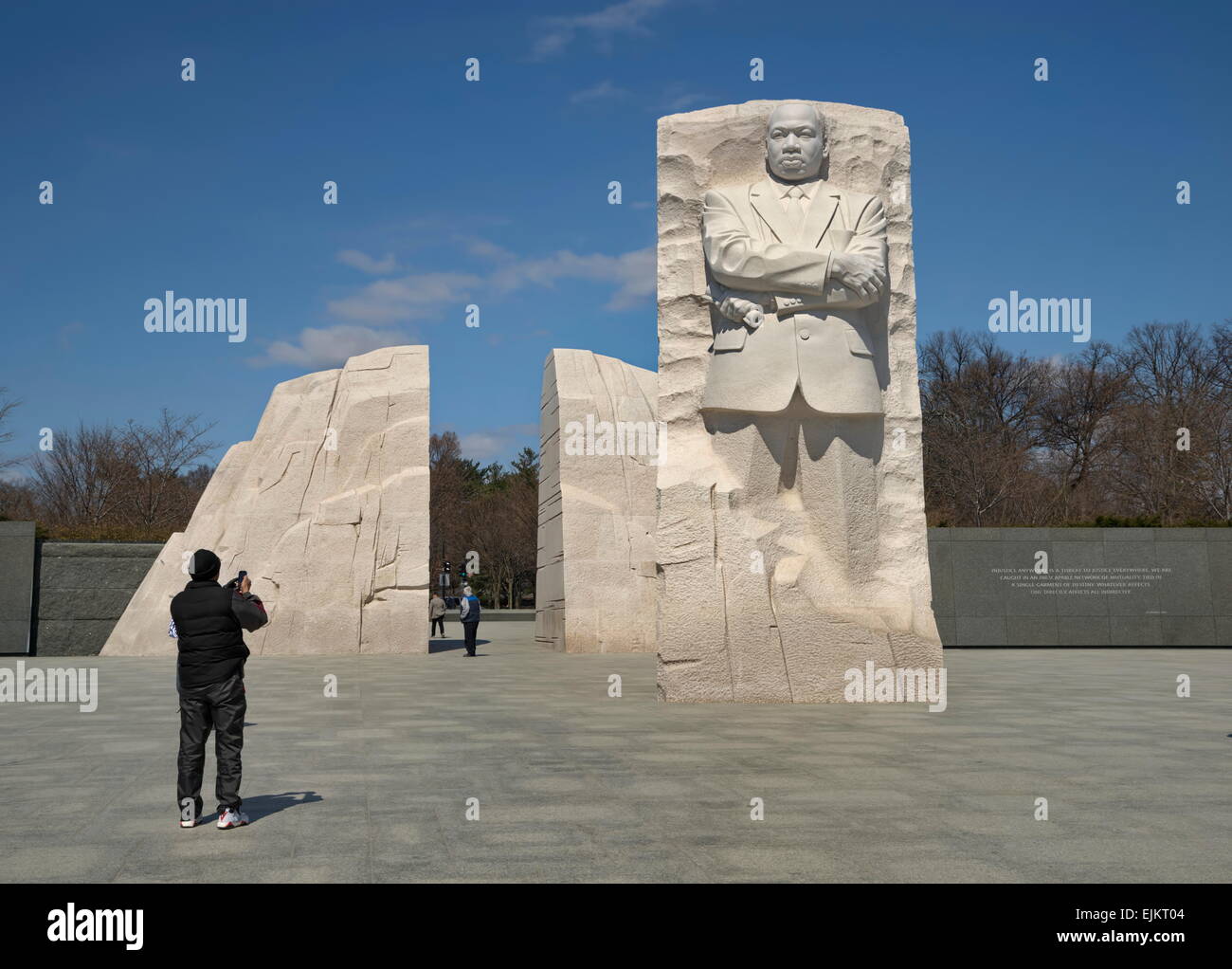 A visitor takes a photograph at the Martin Luther King, Jr. Memorial ...