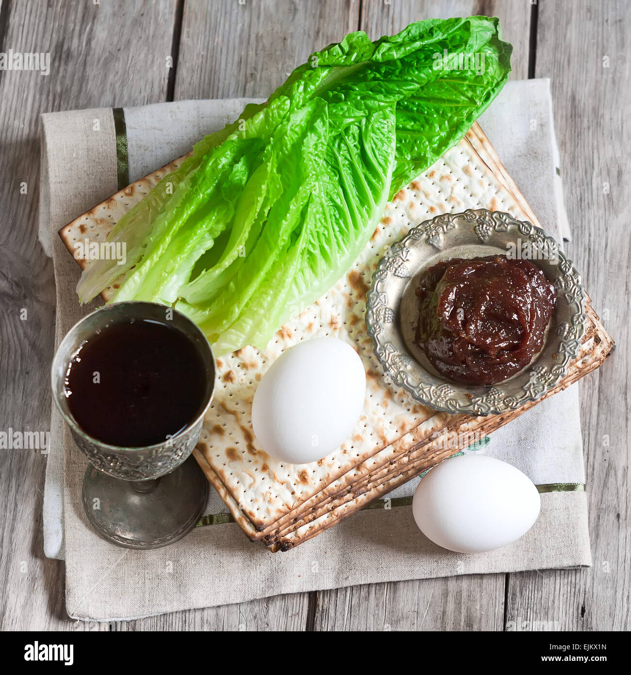 Wine, egg, bitter salad leaves, matzot and haroset - traditional jewish ...
