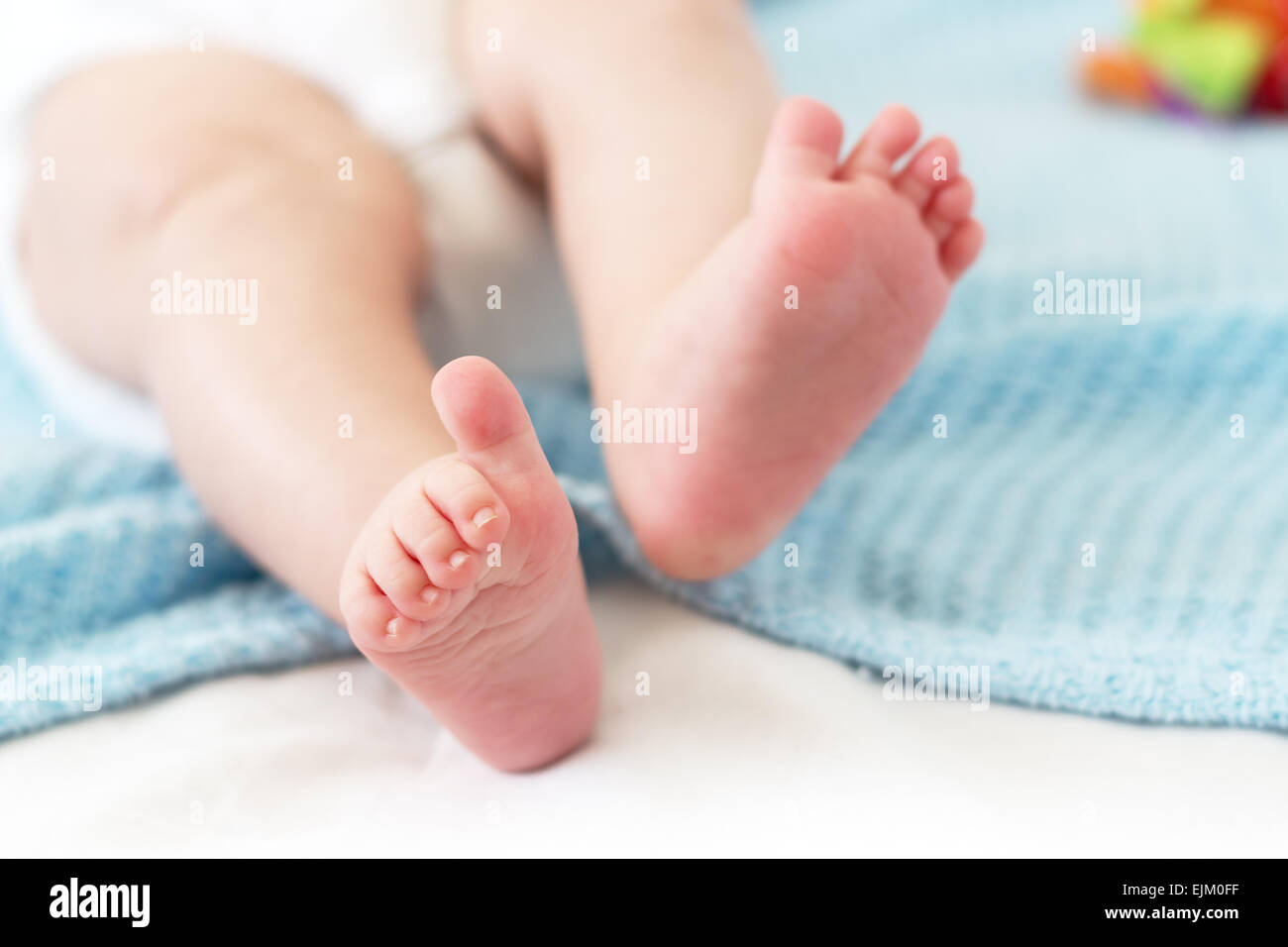 Baby feet on white background Stock Photo - Alamy