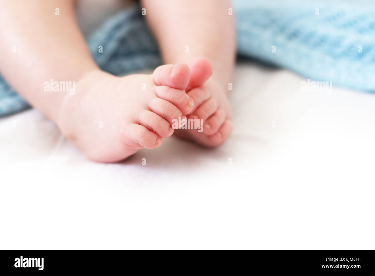 Baby feet on white background Stock Photo - Alamy