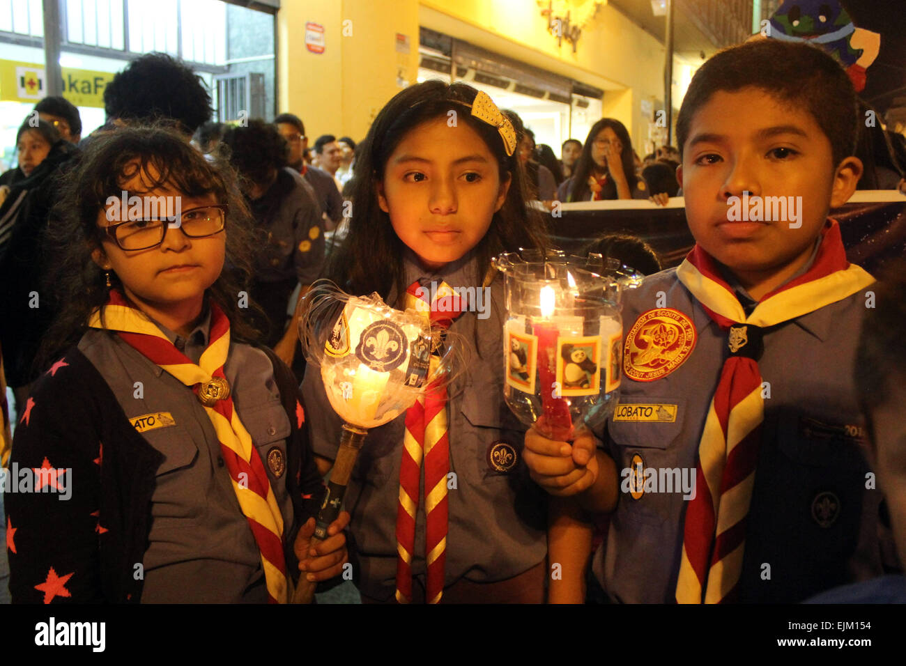 Lima, Peru. 28th Mar, 2015. Children hold lighted candles during an ...