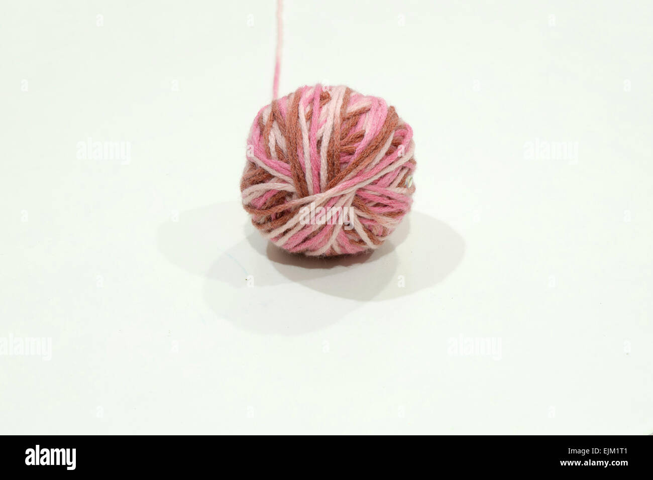 Knitting yarn balls and needles on a white background Stock Photo - Alamy