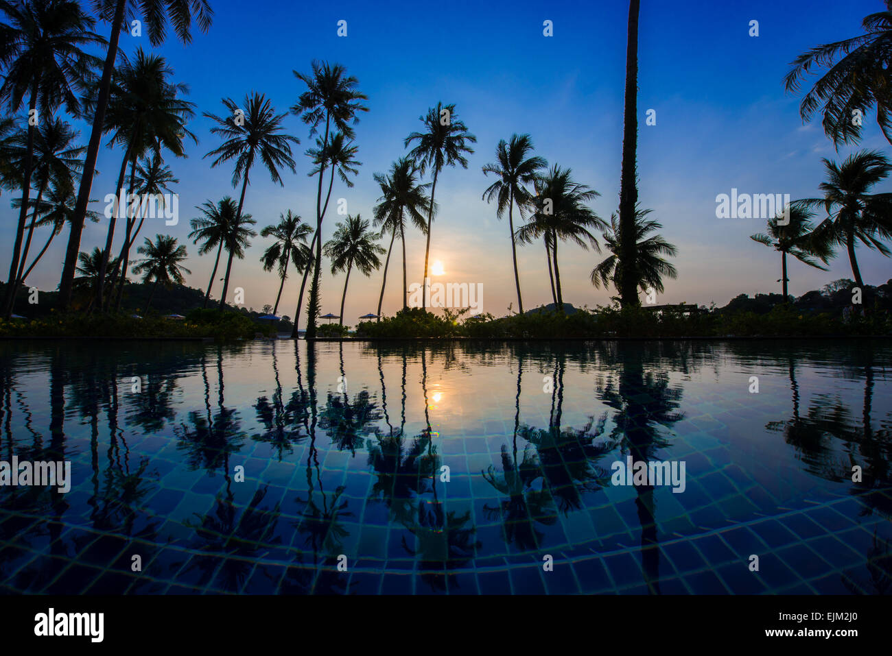 Swimming pool with sunrise Stock Photo - Alamy