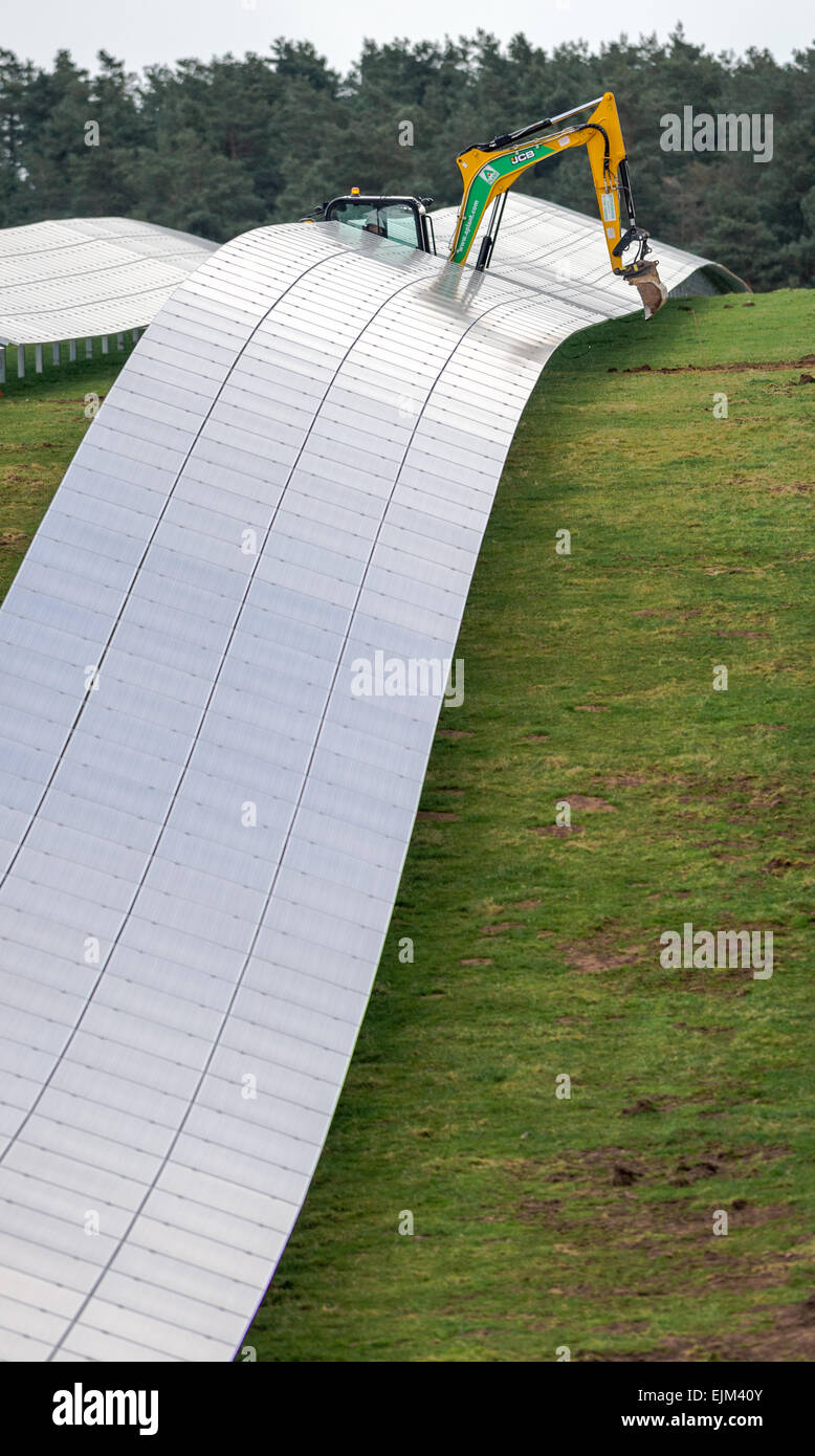 The installation of P.V. solar panels at a solar farm on the Welbeck ...