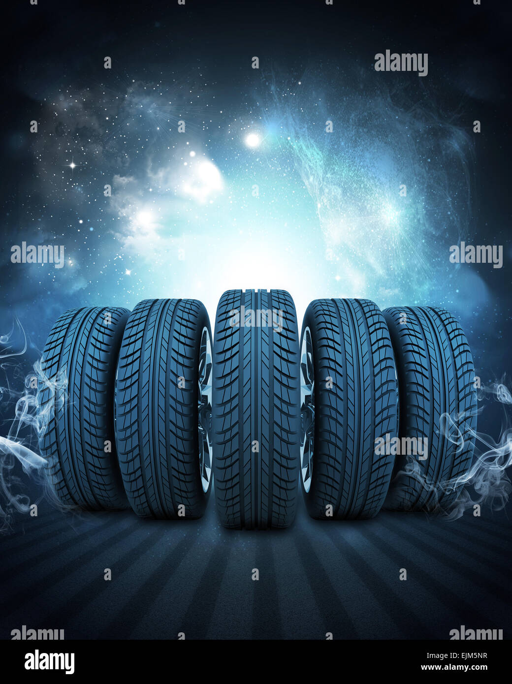 Wedge of new car wheels. Background is night sky and stripes at bottom ...