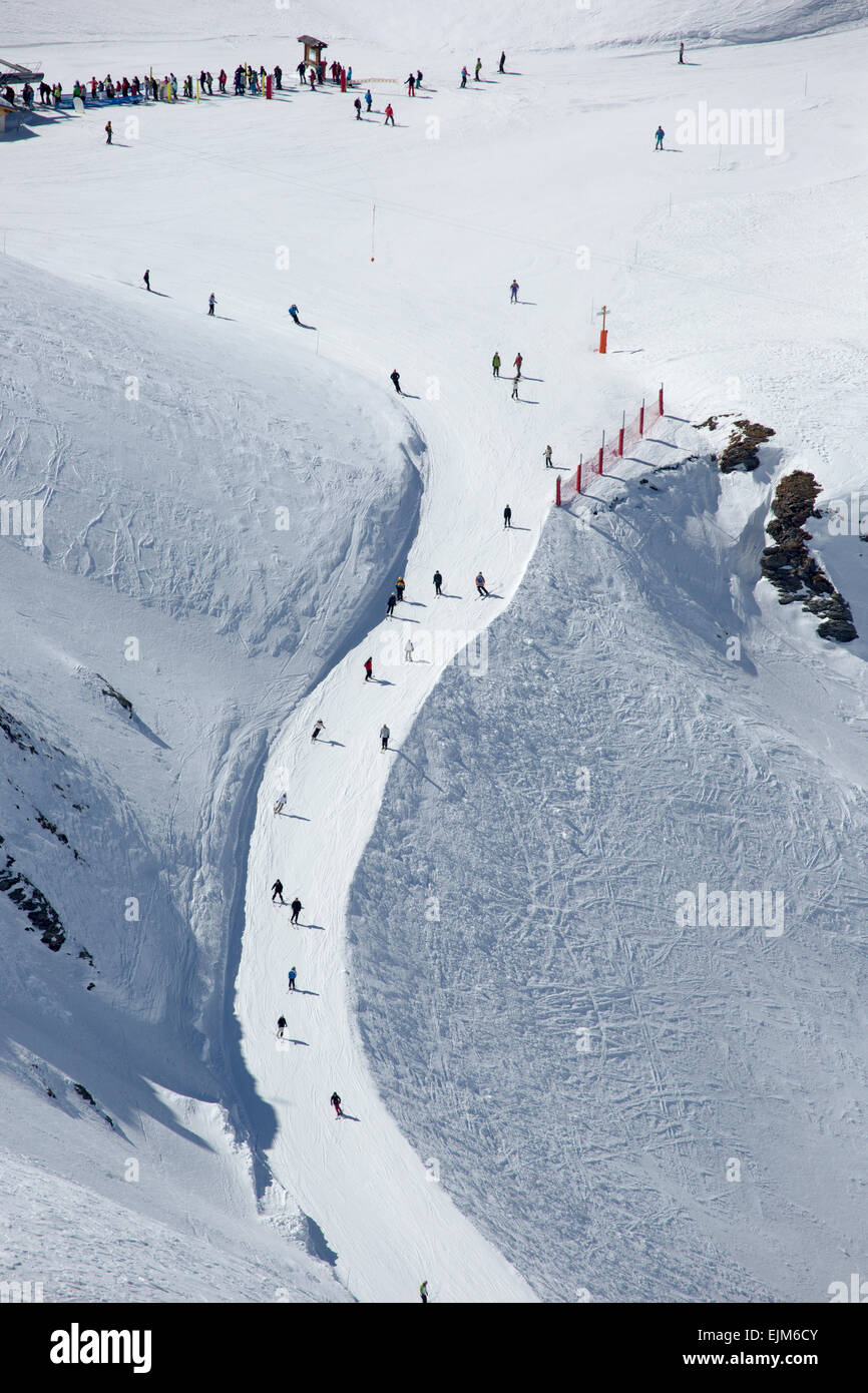 skiers heading down the piste Stock Photo - Alamy