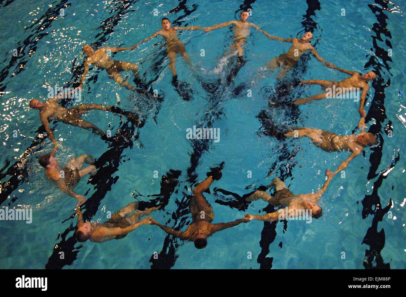 Naval Sea Cadets work on their team swim during group physical fitness ...