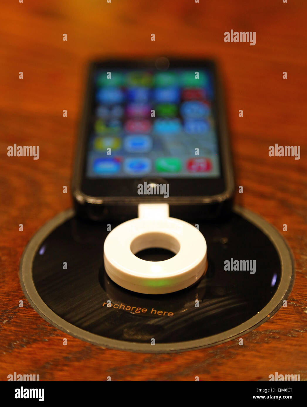 Plugging charger into mobile telephone hi-res stock photography and ...