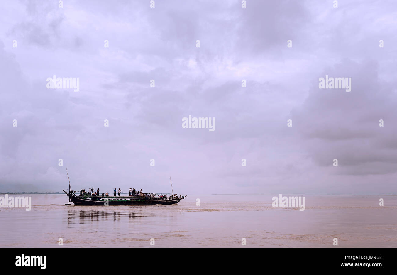 Public ferry full of passengers and cargo from Majuli Island crosses ...