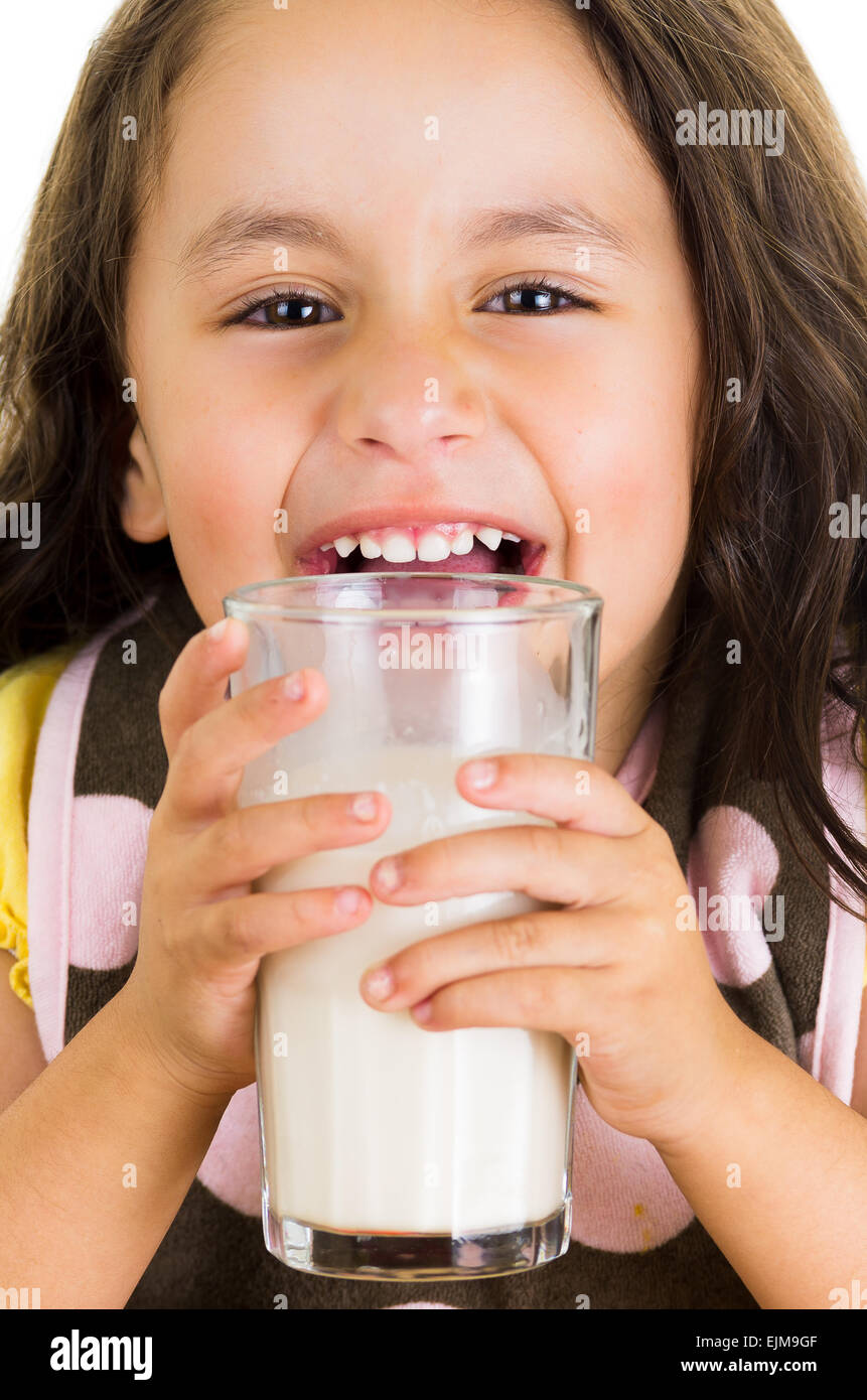 Cute little preschooler girl drinking a glass of milk Stock Photo - Alamy
