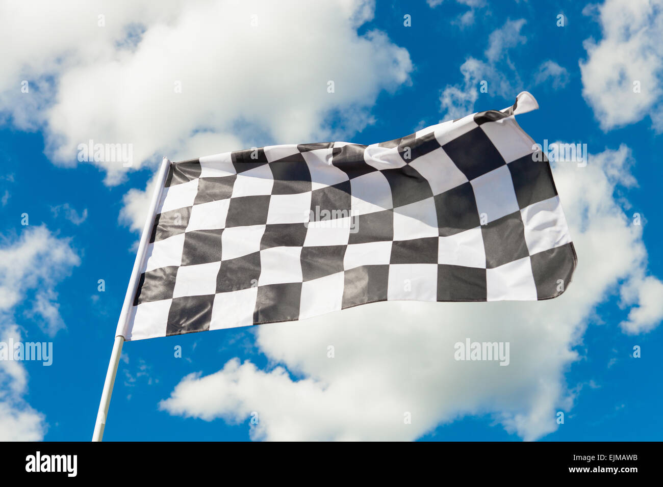 Checkered flag waving in the wind - clouds on background Stock Photo ...