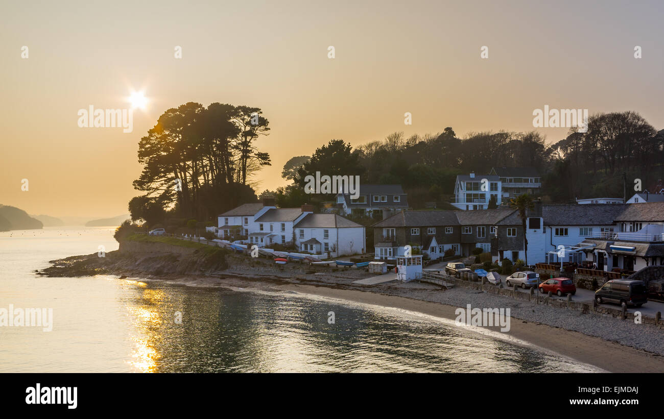 Sun setting over the riverside village of Helford Passage Cornwall ...