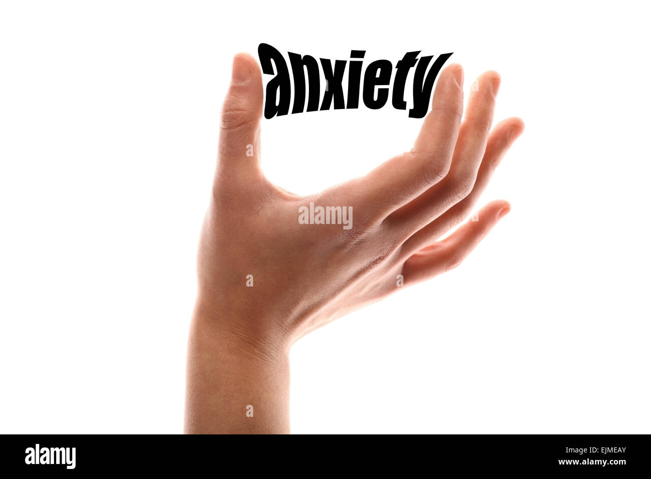Color horizontal shot of a hand holding the word "anxiety" between two ...