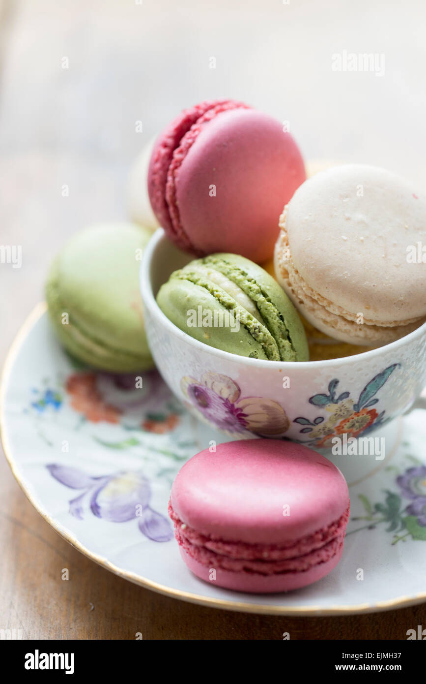 Multi colorered macarons in vintage tea cup, Paris, France Stock Photo ...