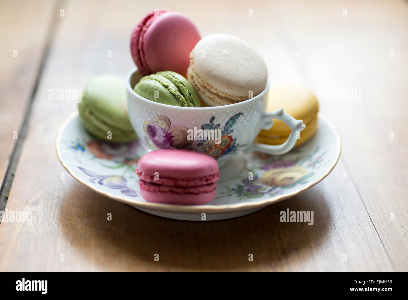 Multi colorered macarons in vintage tea cup, Paris, France Stock Photo ...