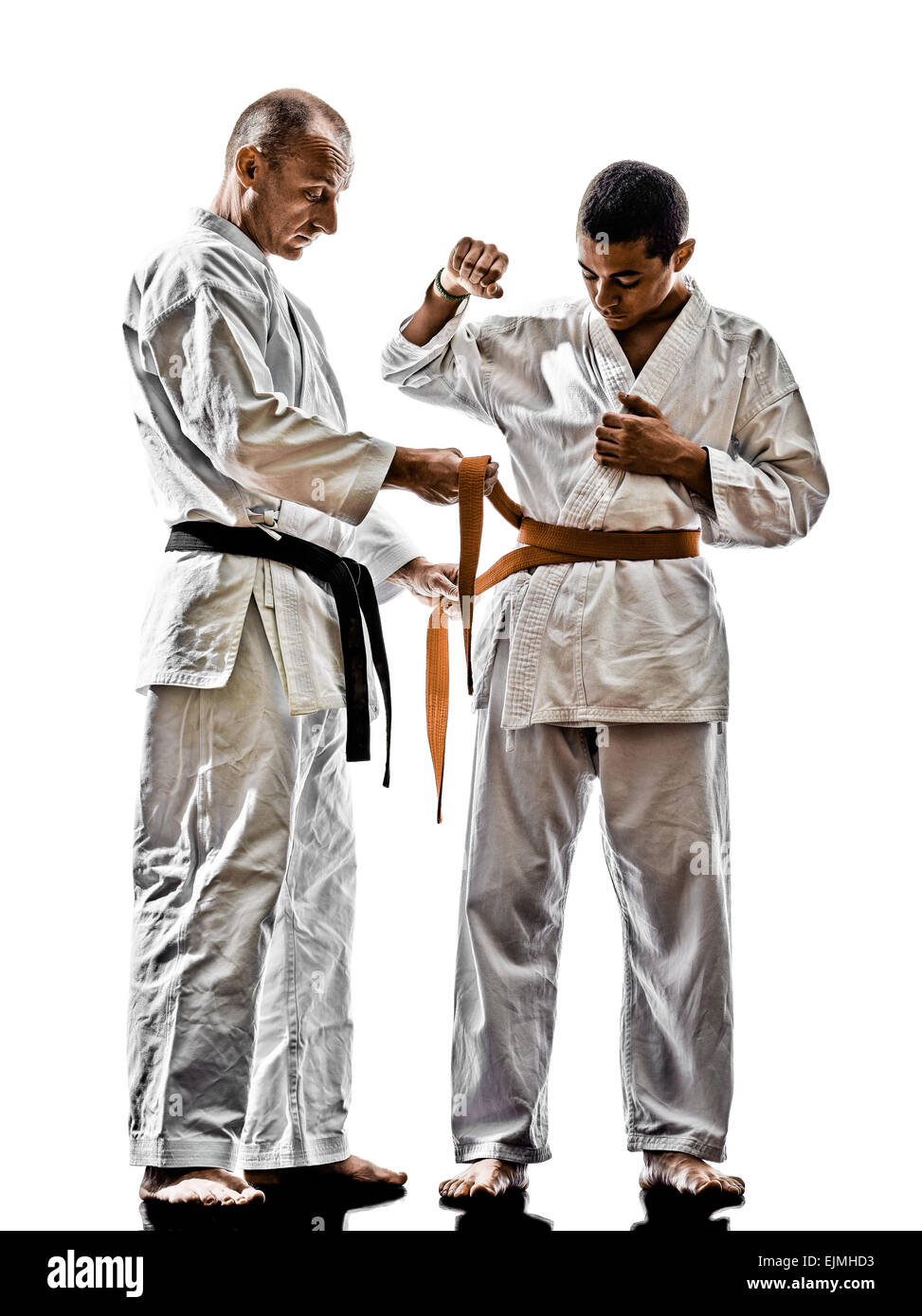 two karate men sensei and teenager student teacher teaching isolated on ...