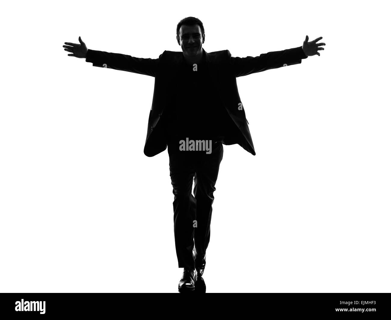 one caucasian business man arms outstretched in silhouette on white ...