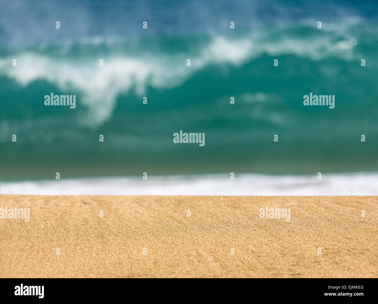 Smooth and sandy beach leading into the distance with waves Stock Photo ...