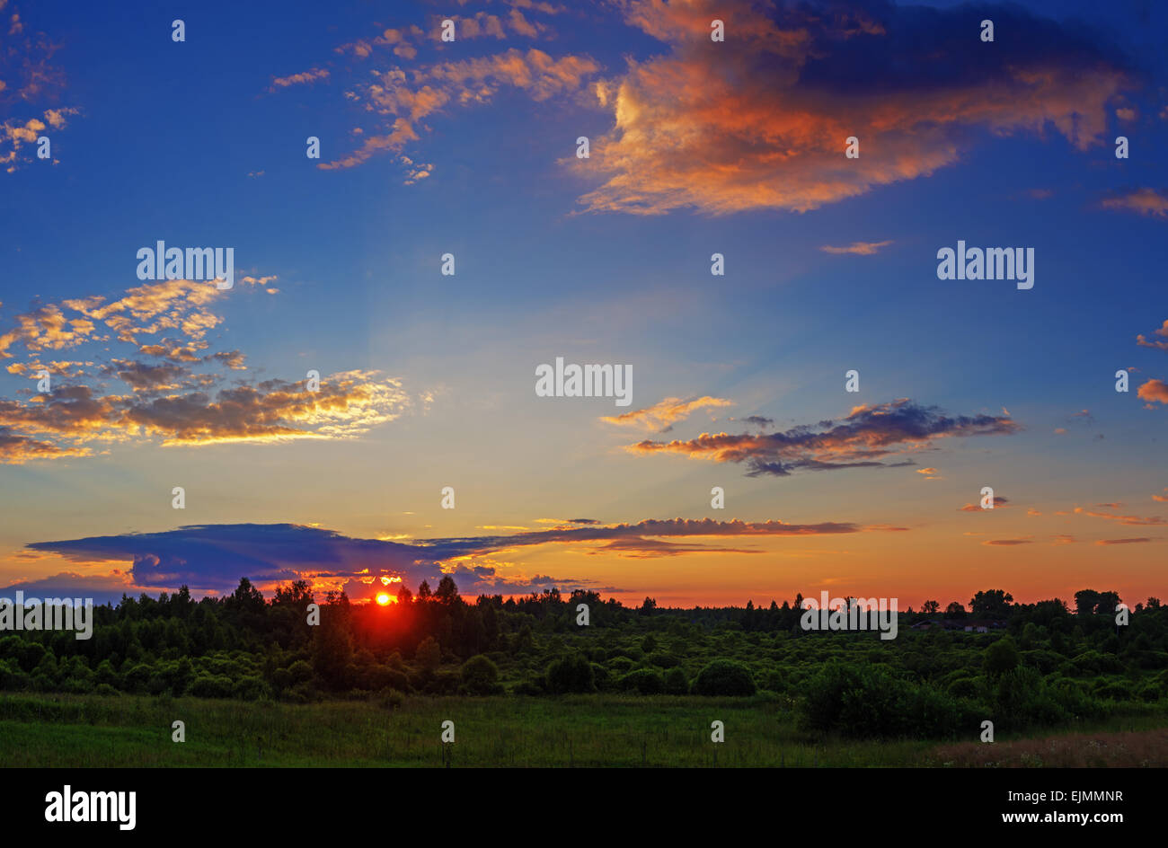 Cloudy sunset - rural landscape Stock Photo - Alamy