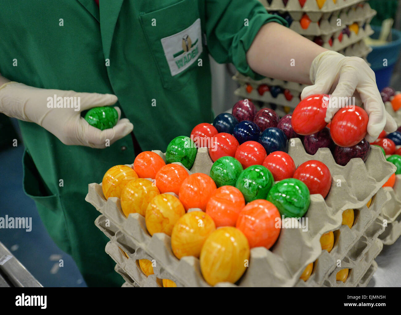 Prinzhoefte, Germany. 25th Mar, 2015. A staff member places colourful ...